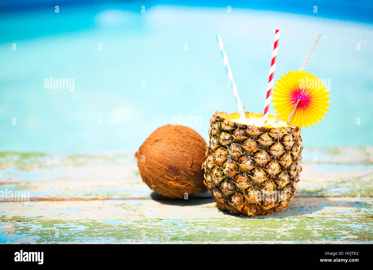 Exotic pineapple cocktail near pool. Pina colada Stock Photo - Alamy