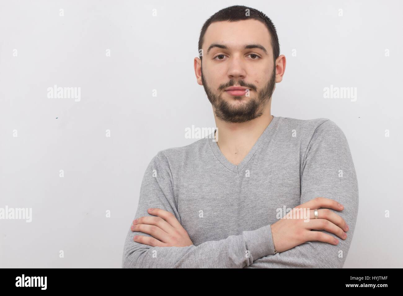 Young man posing on light background. Mock up Stock Photo - Alamy
