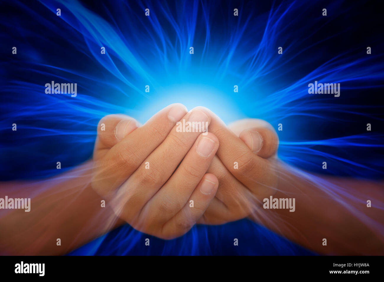 Child hands with blue power rays Stock Photo - Alamy
