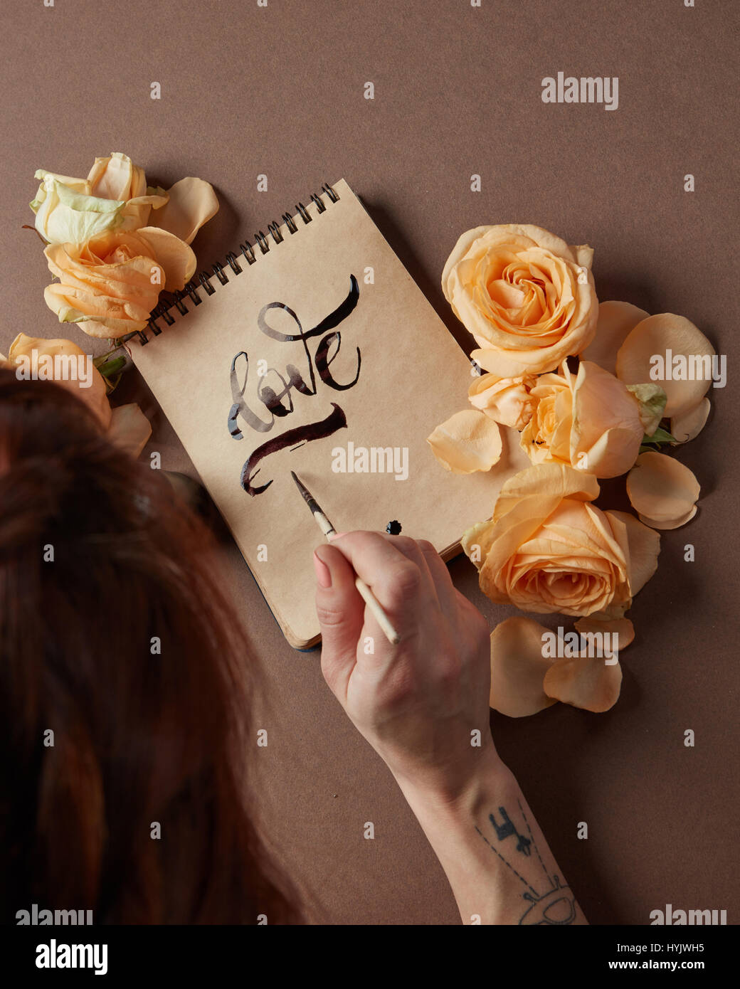 Hand with brush writing a love letter Stock Photo - Alamy