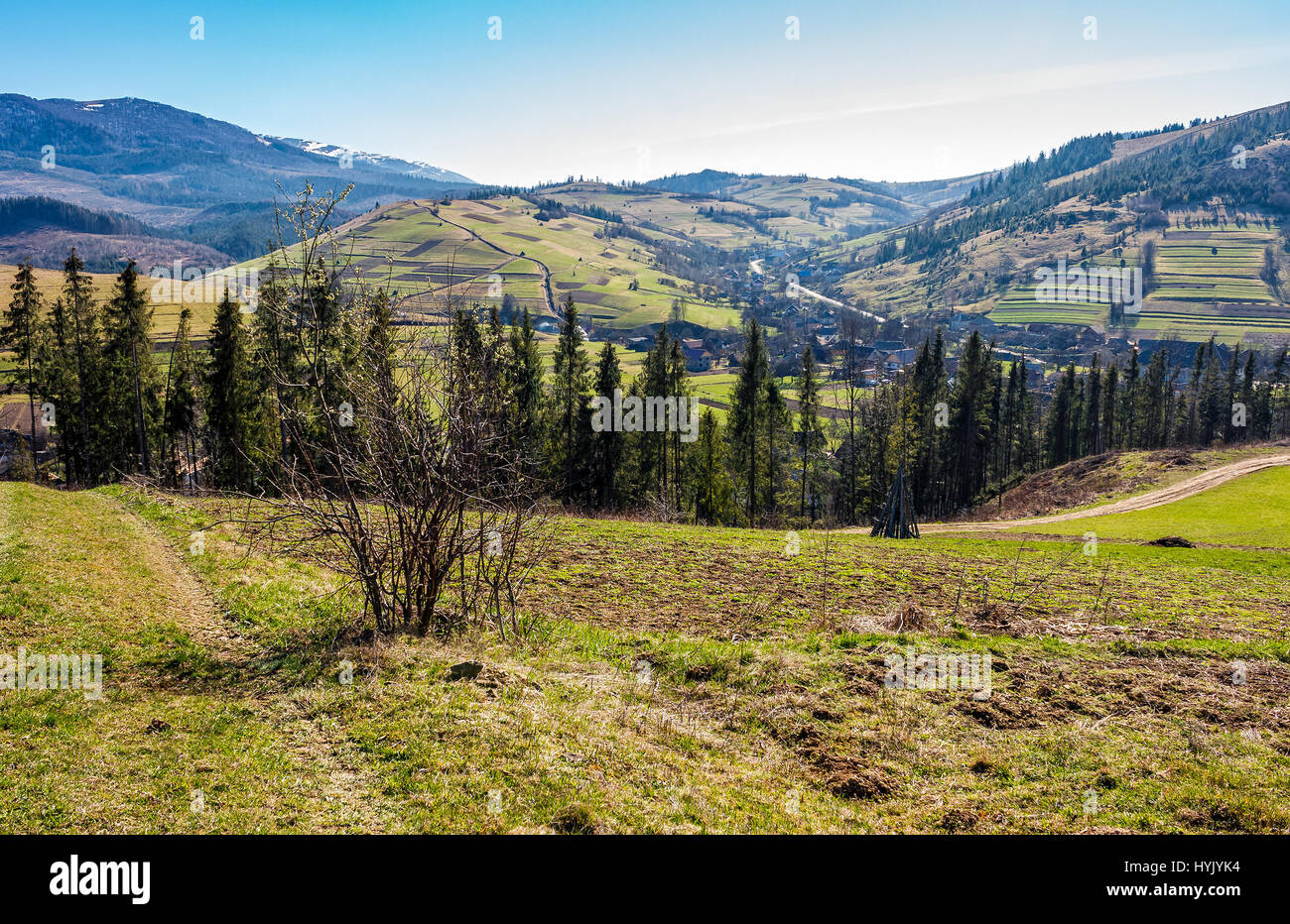 mountain rural area in springtime season. agricultural field on a hill ...