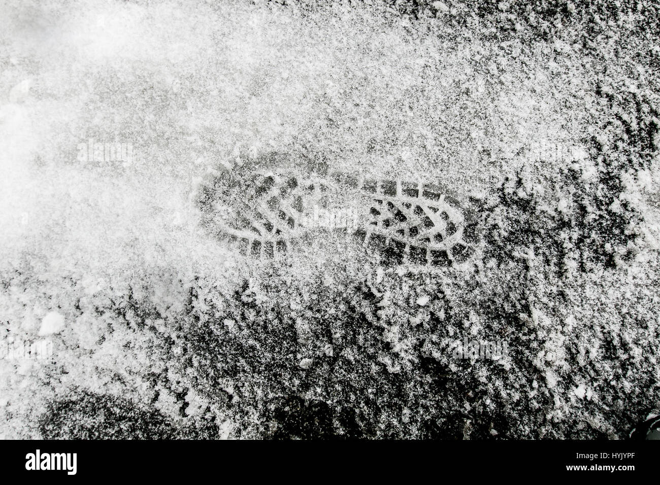 Shoe print in the snow Stock Photo - Alamy