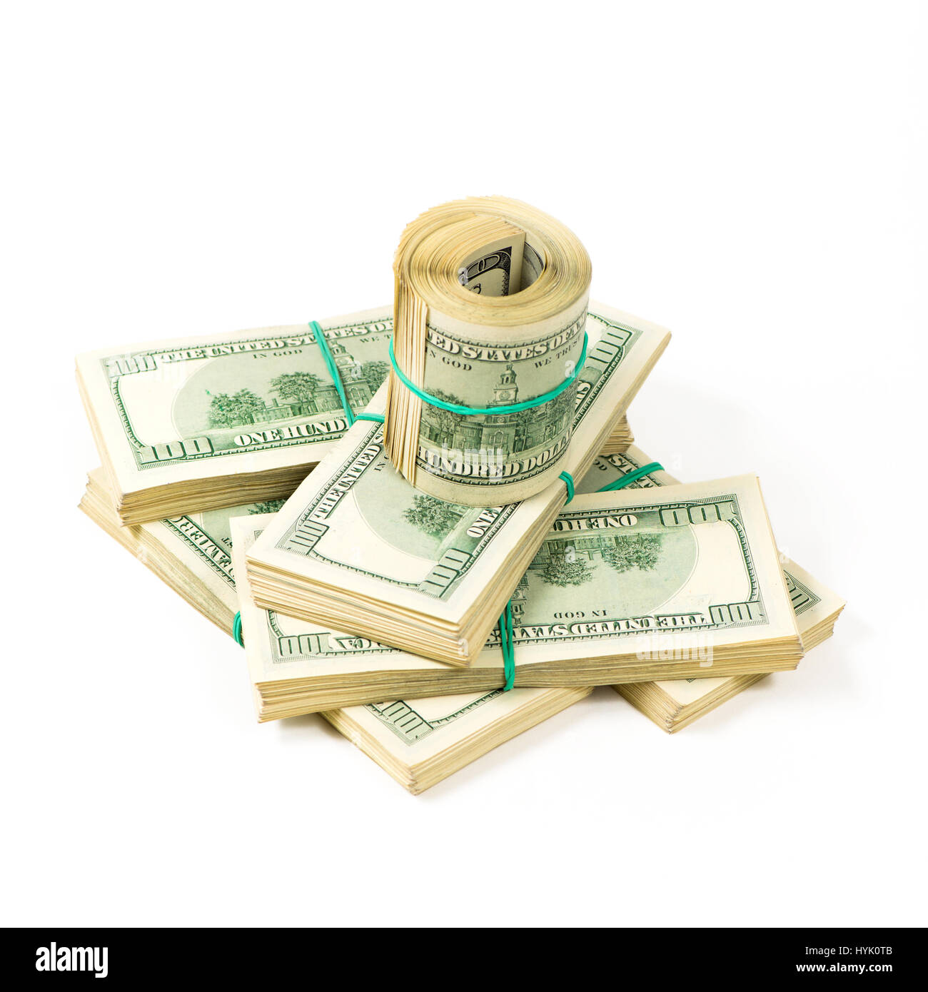 A twisted bundle of 100 dollar bills stands on packs of dollars Stock ...
