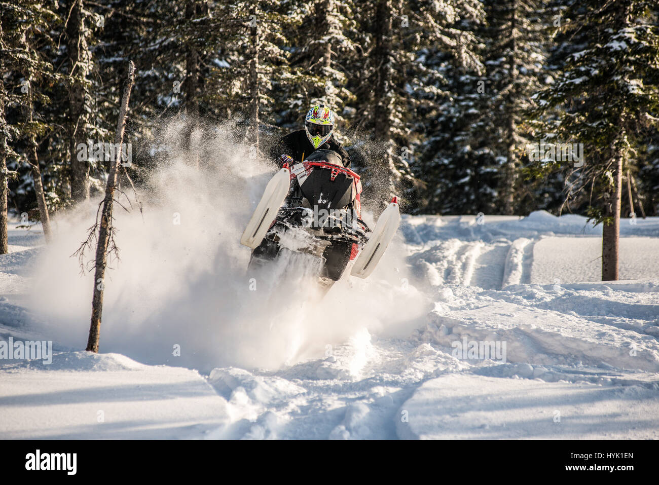 Rider on the snowmobile in the mountains. active drive Stock Photo - Alamy