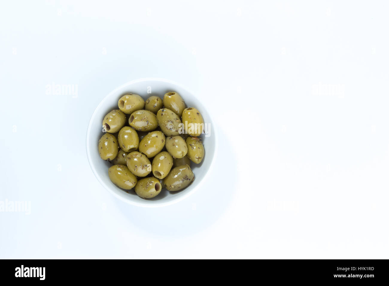 Olives very fresh, seasoned and prepared in na white bowl isolated in ...