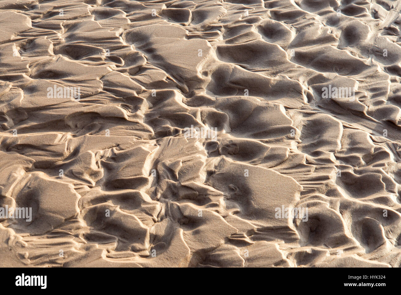 Wet sand texture in the sea shore beach Stock Photo - Alamy