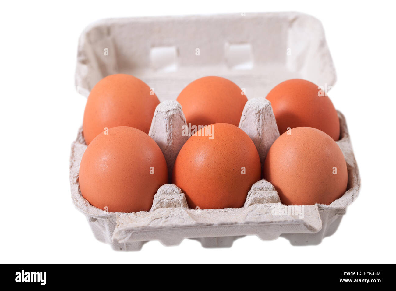 Six eggs in box isolated on white Stock Photo - Alamy