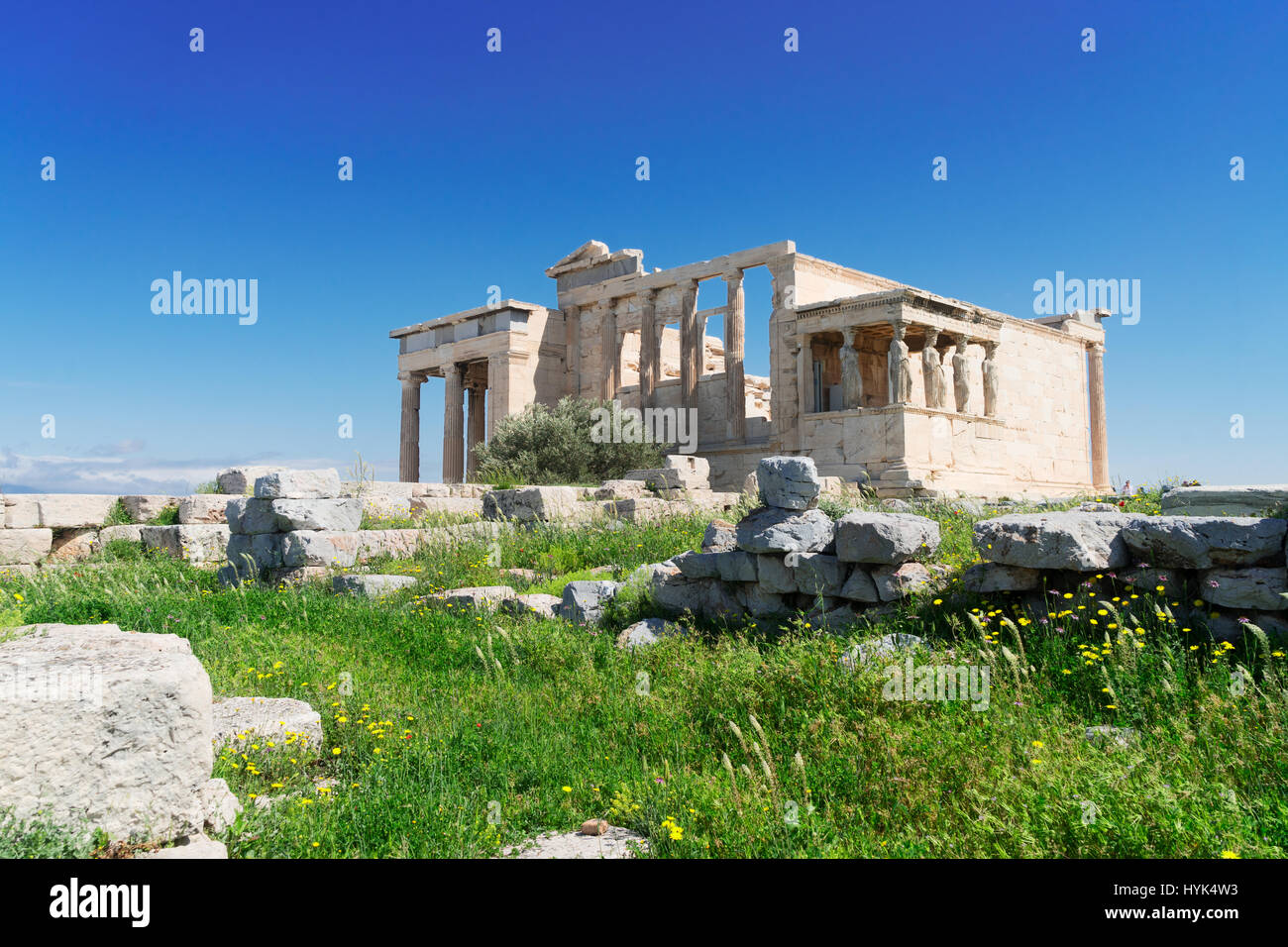 Erechtheion temple with green grass in Acropolis of Athens, Greece ...