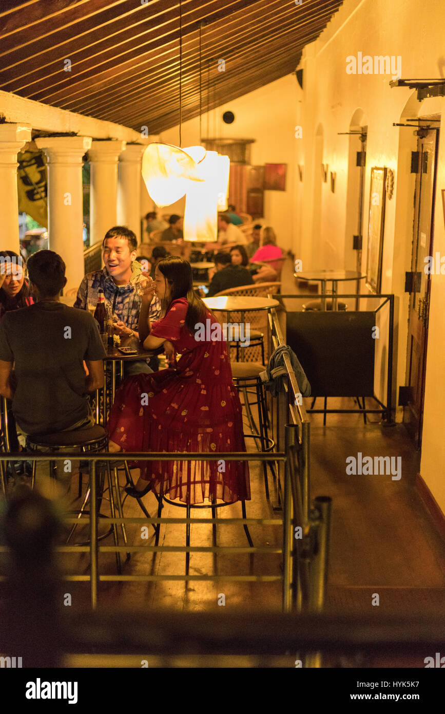 People eating and drinkling in a colonial style old pub in Kandy - Sri ...