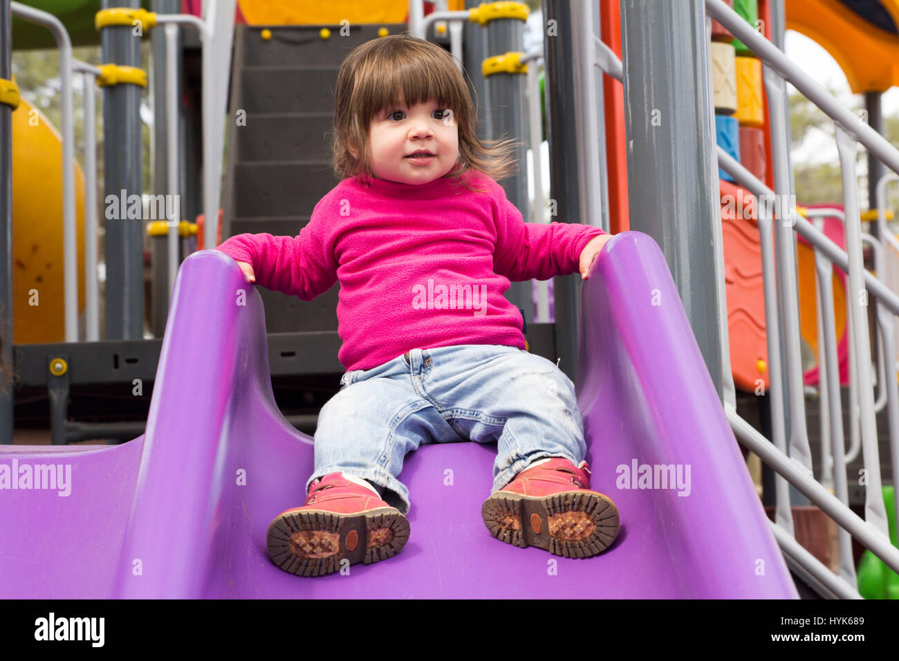 Girl sliding down the slide hi-res stock photography and images - Alamy