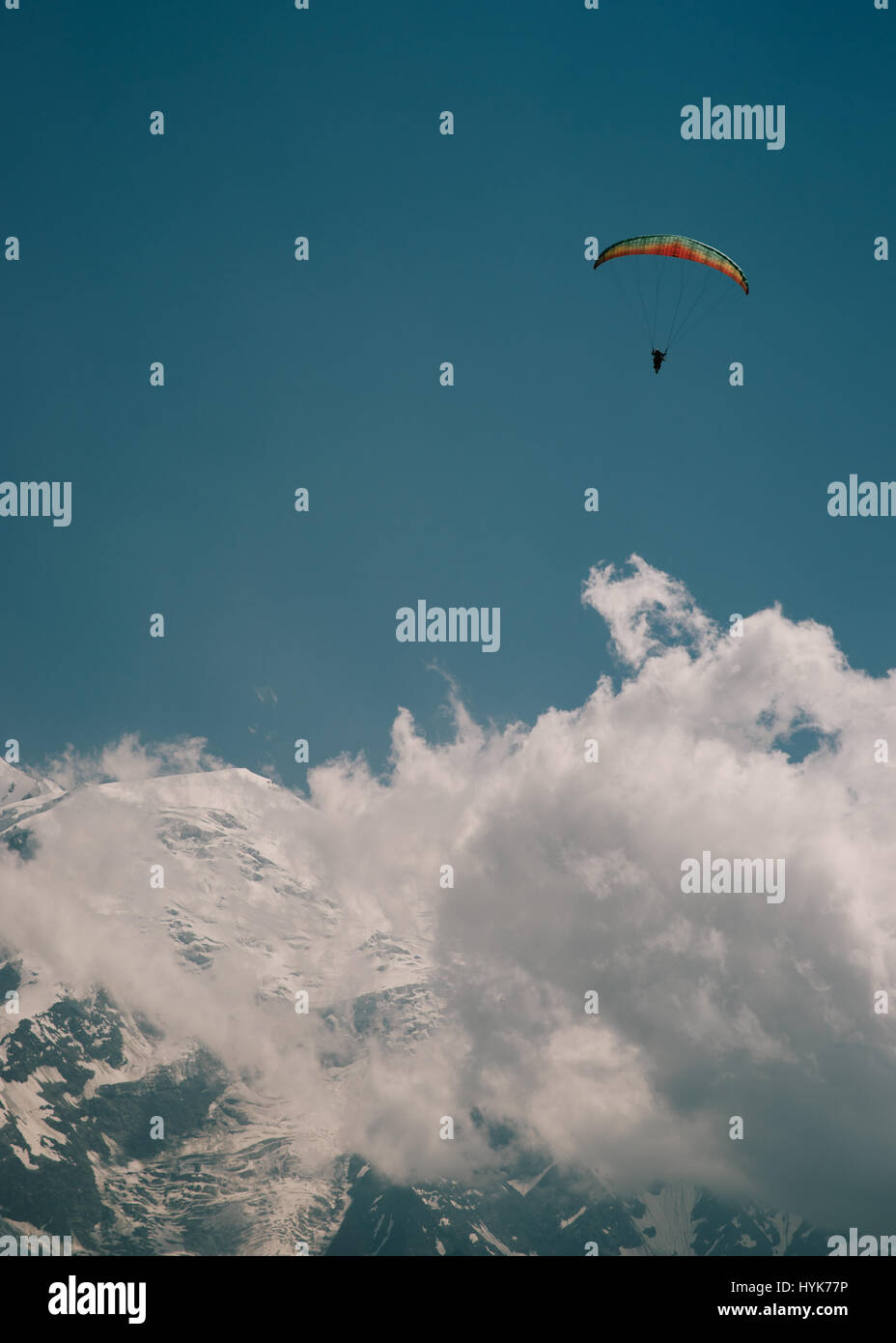 Paragliding over mountains Stock Photo - Alamy