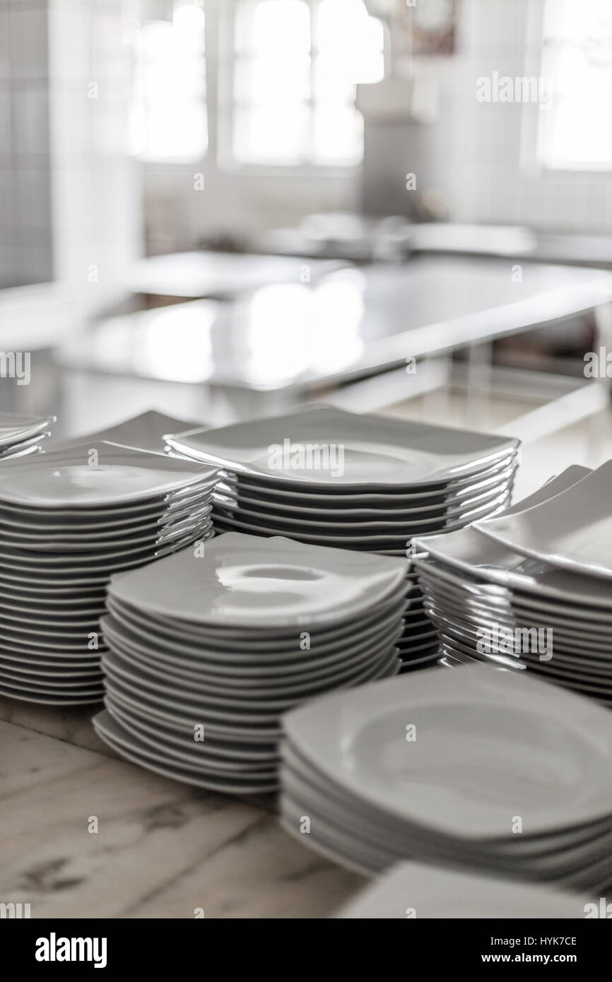Stack of many white different plates Stock Photo - Alamy