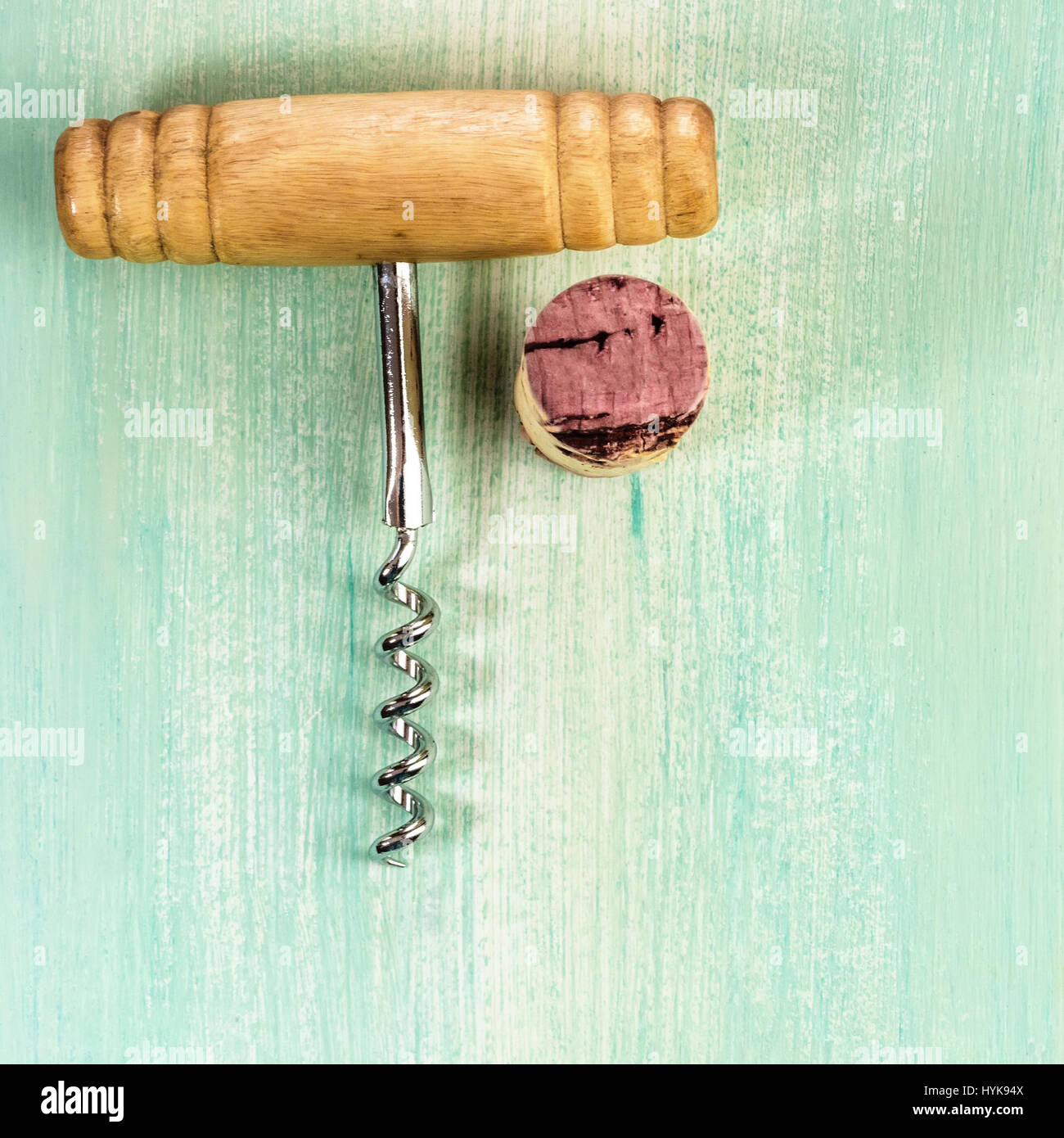 A square photo of an old-fashioned corkscrew with a cork, shot from ...