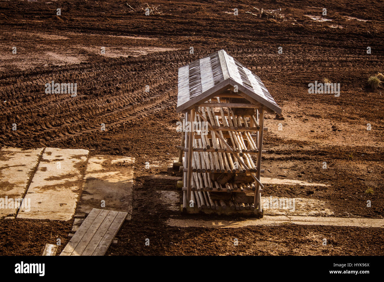 An early spring landscape of a marsh where peat is being harvested ...