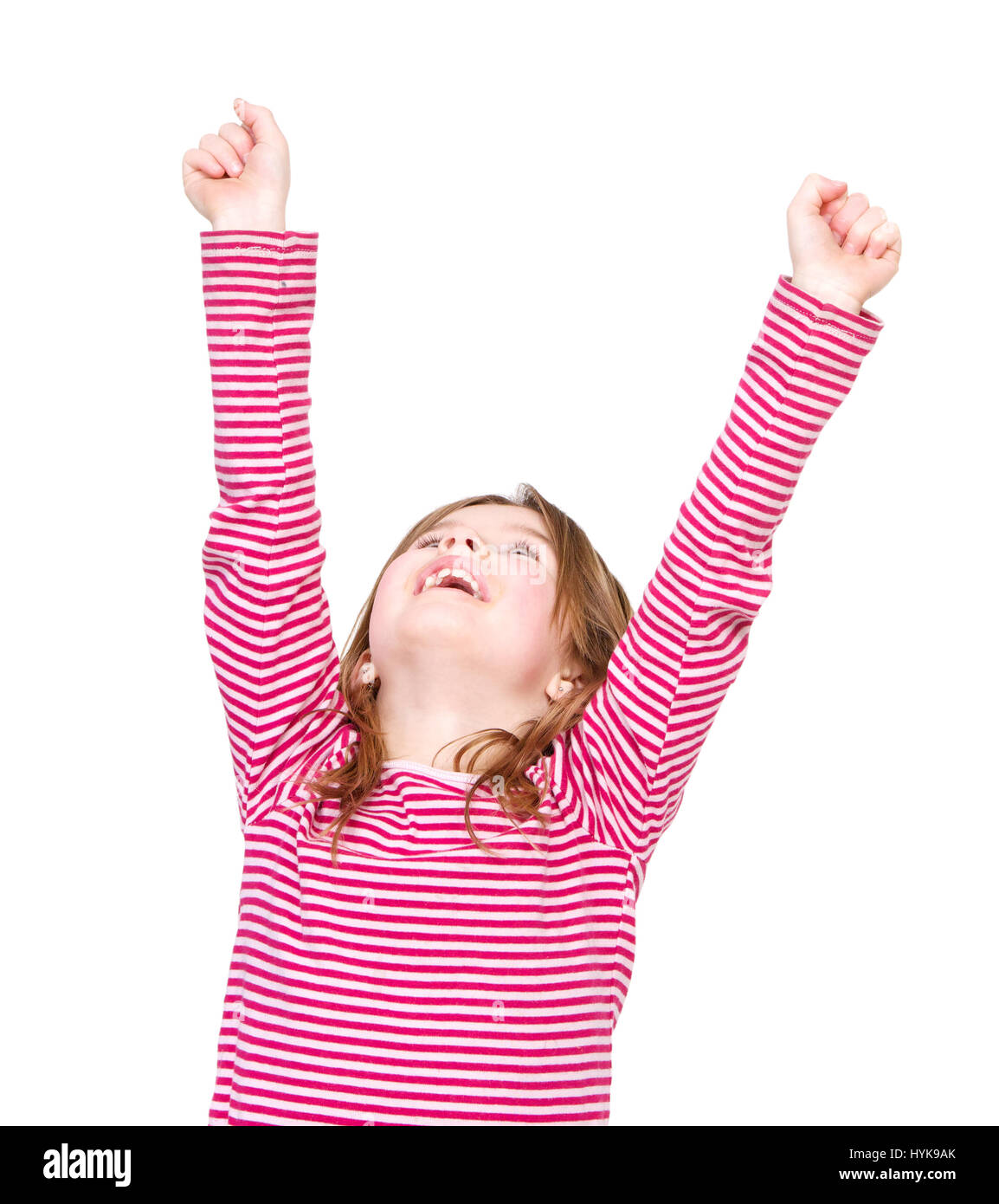 Close up portrait of a happy young girl cheering with arms raised on ...