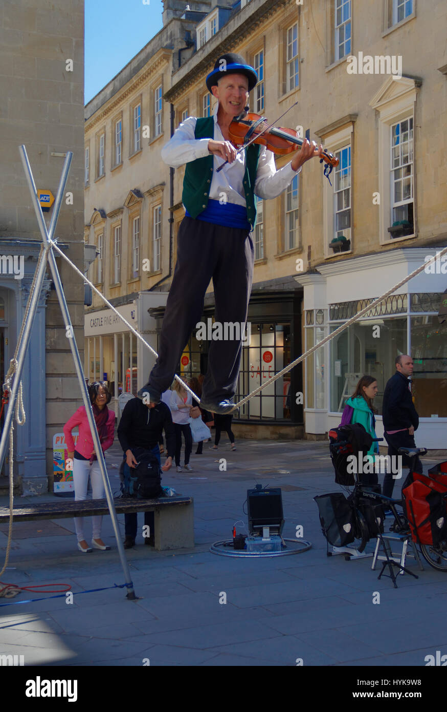 Street entertainer, playing a violin while balancing on a wire Stock ...