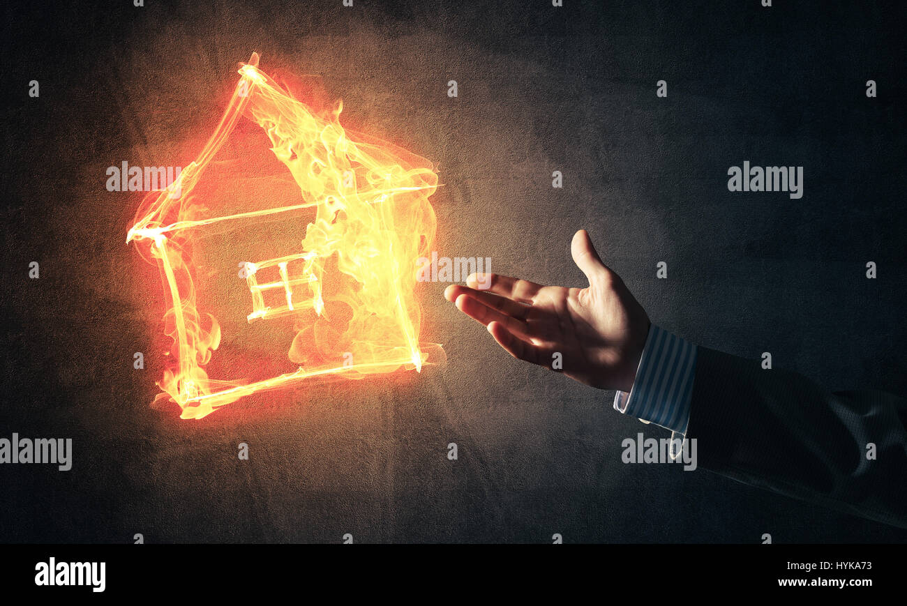 Businessman hand pointing at burning fire symbol Stock Photo - Alamy