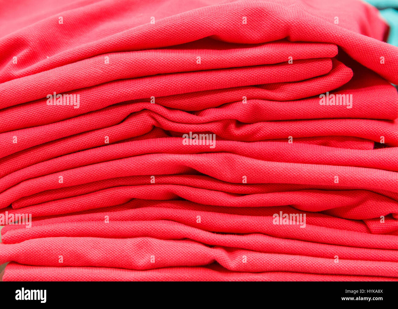 A stack of red T-shirts on the shelves Stock Photo - Alamy