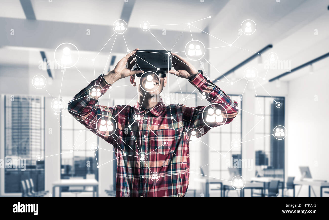 Guy wearing checked shirt and virtual mask demonstrating some em Stock ...