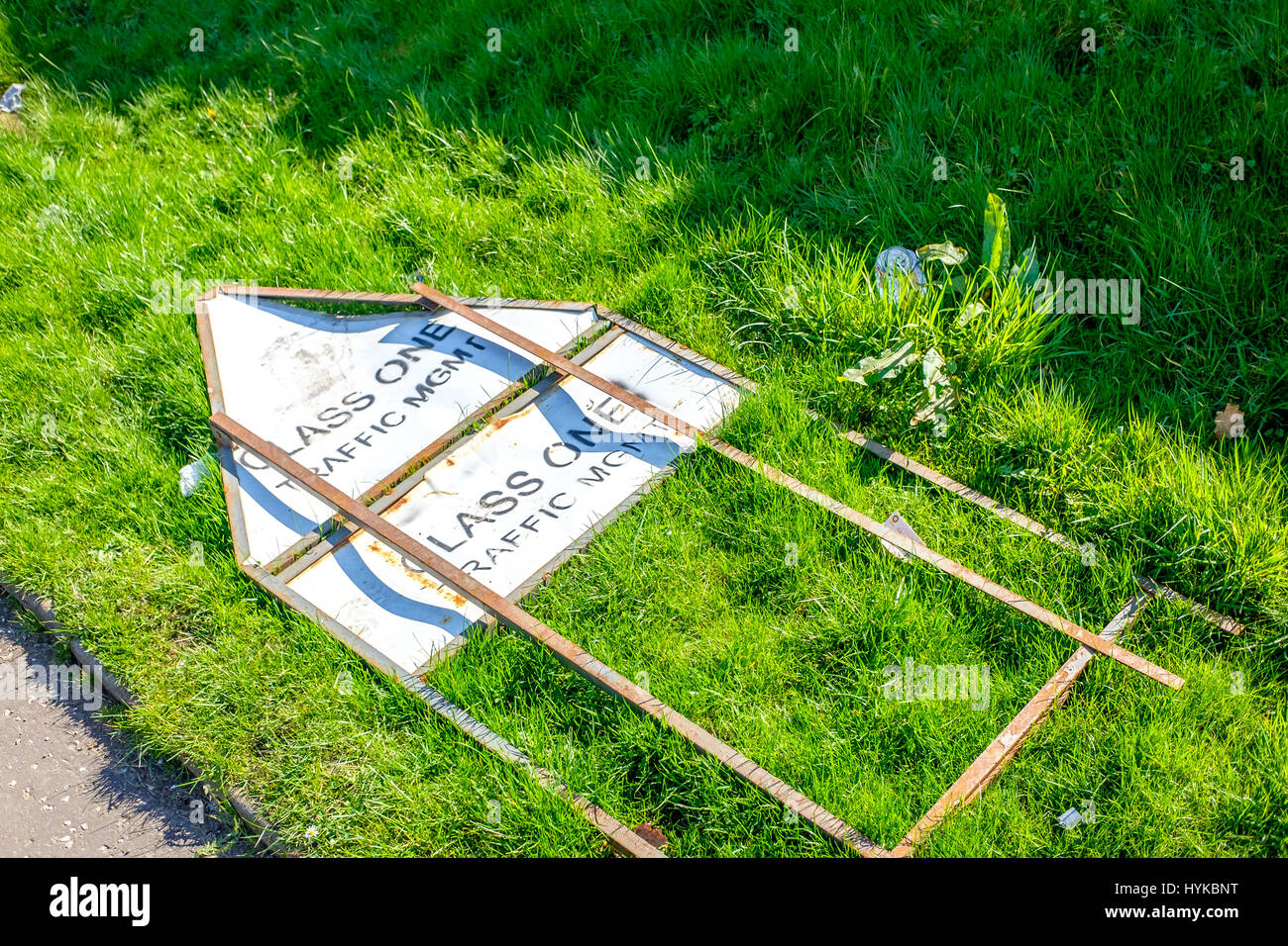 class one traffic management road sign thrown onto grass verge Stock ...