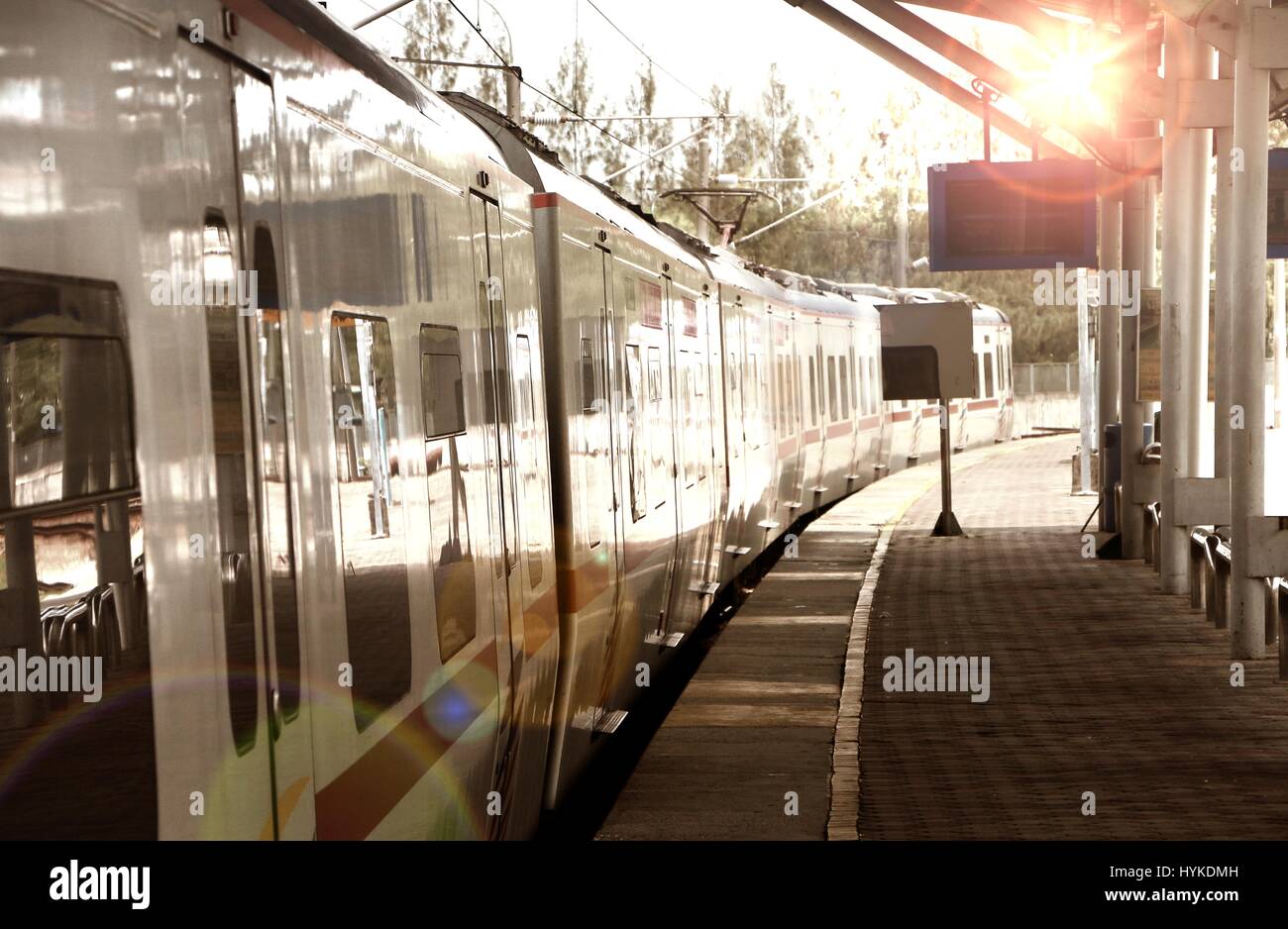 Train arriving at station Stock Photo - Alamy