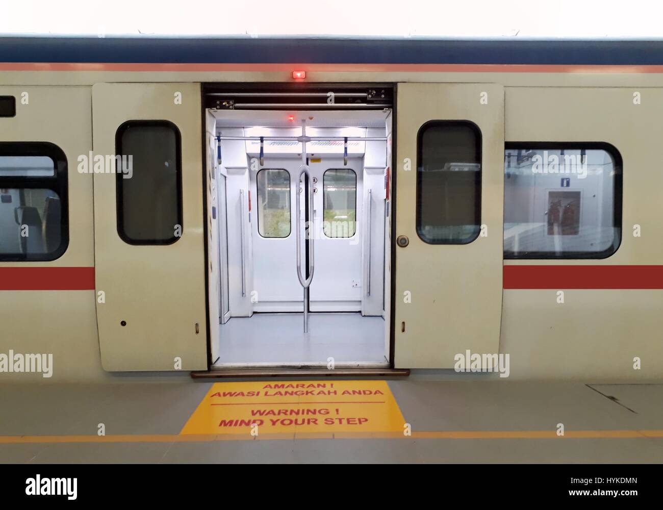 Train at station platform with open door Stock Photo - Alamy