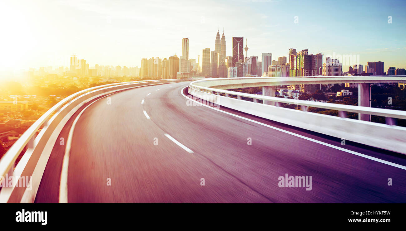 Highway overpass motion blur with city background . sunrise scene Stock ...