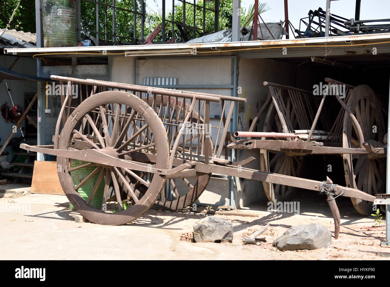 Old teak buffalo carts stored in the grounds of Wat Leng Hok Yee temple ...