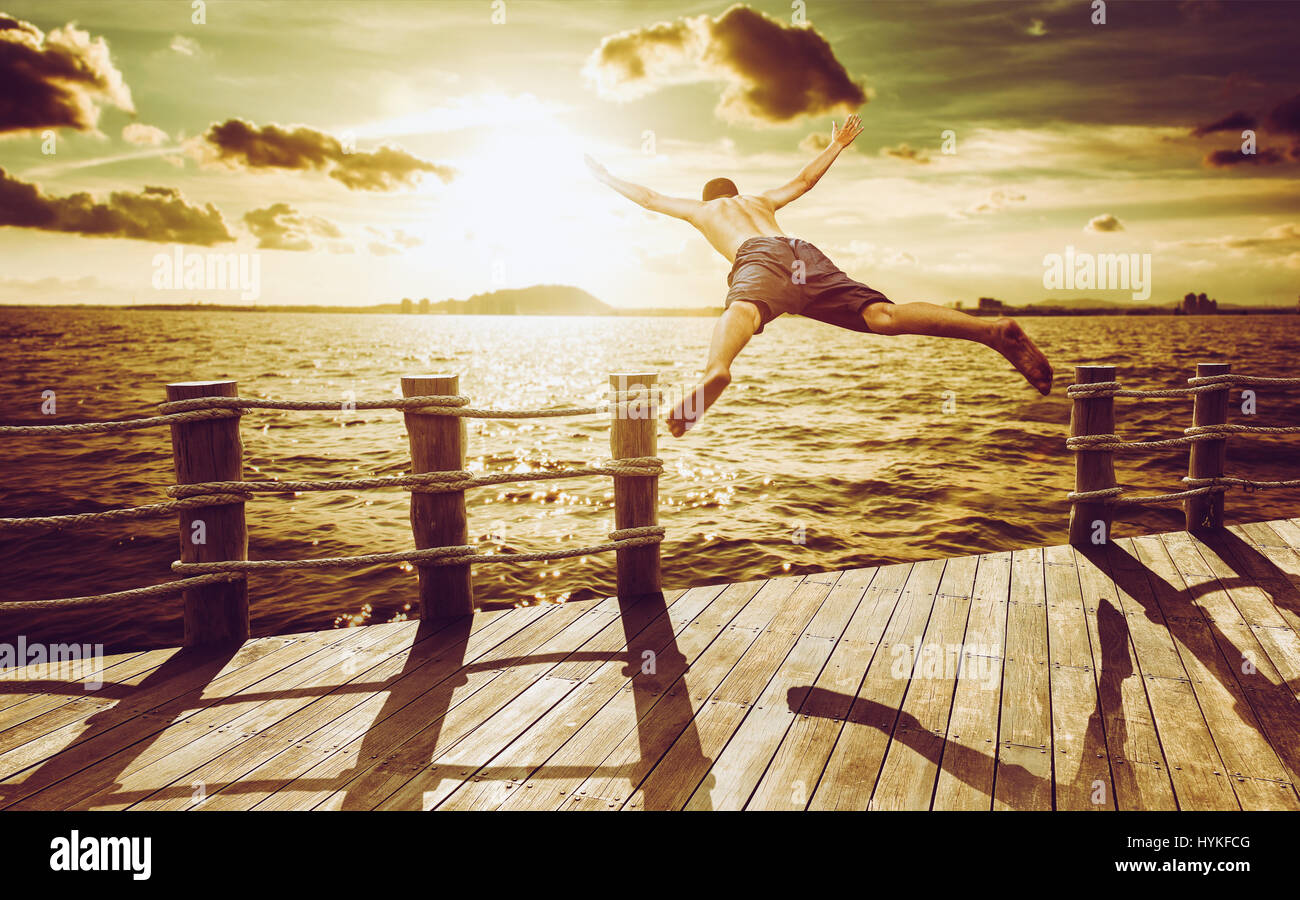 Cliff Jumping into the Ocean at Sunset, Summer Fun Lifestyle Stock ...