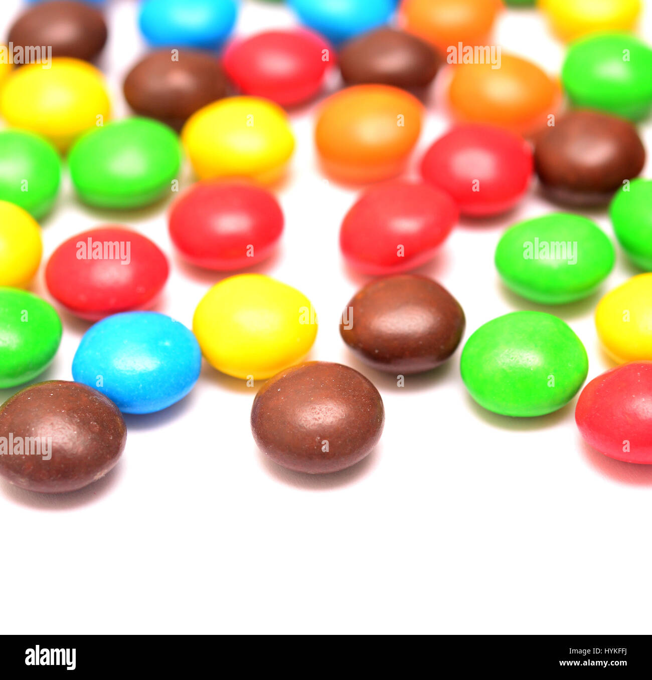 Multicolored candy on white background Stock Photo - Alamy