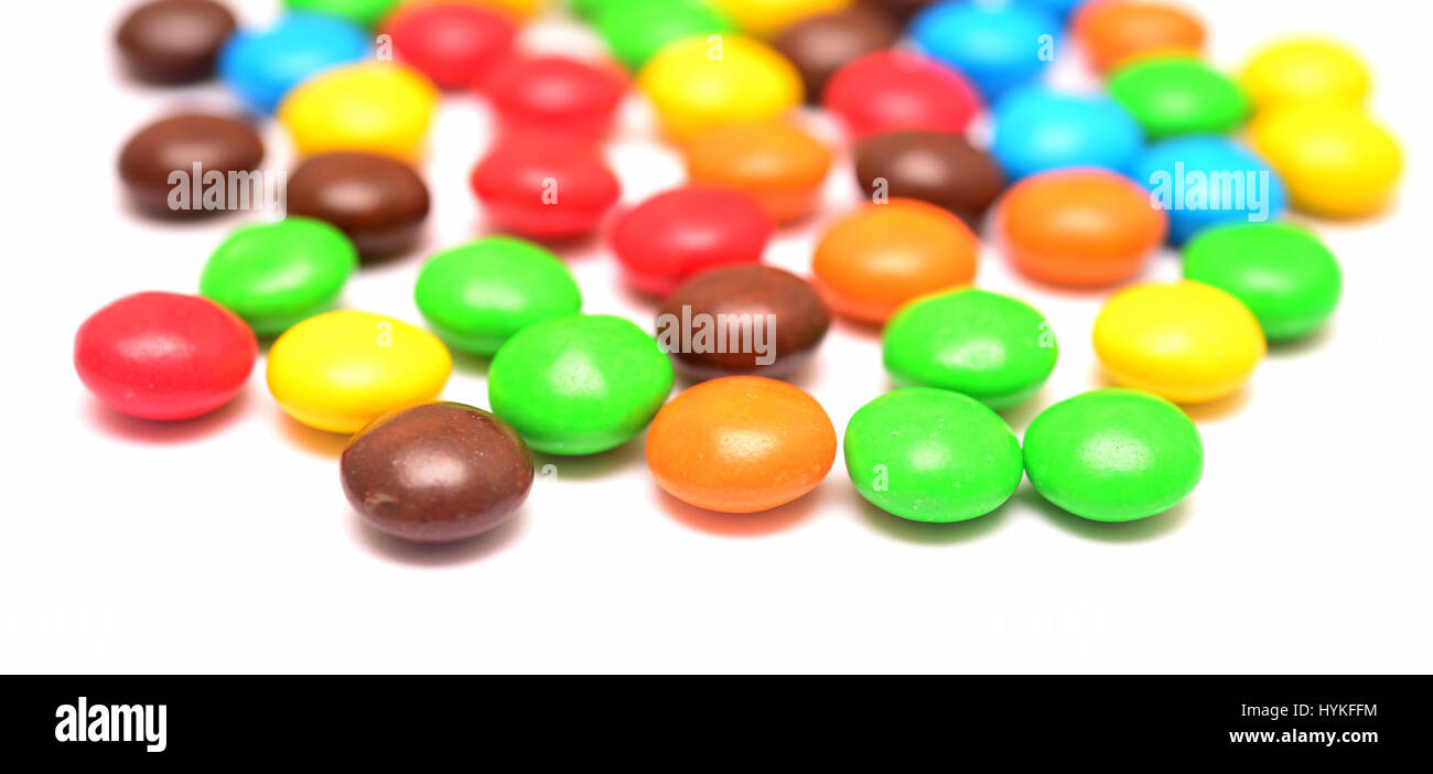 Multicolored candy on white background Stock Photo - Alamy
