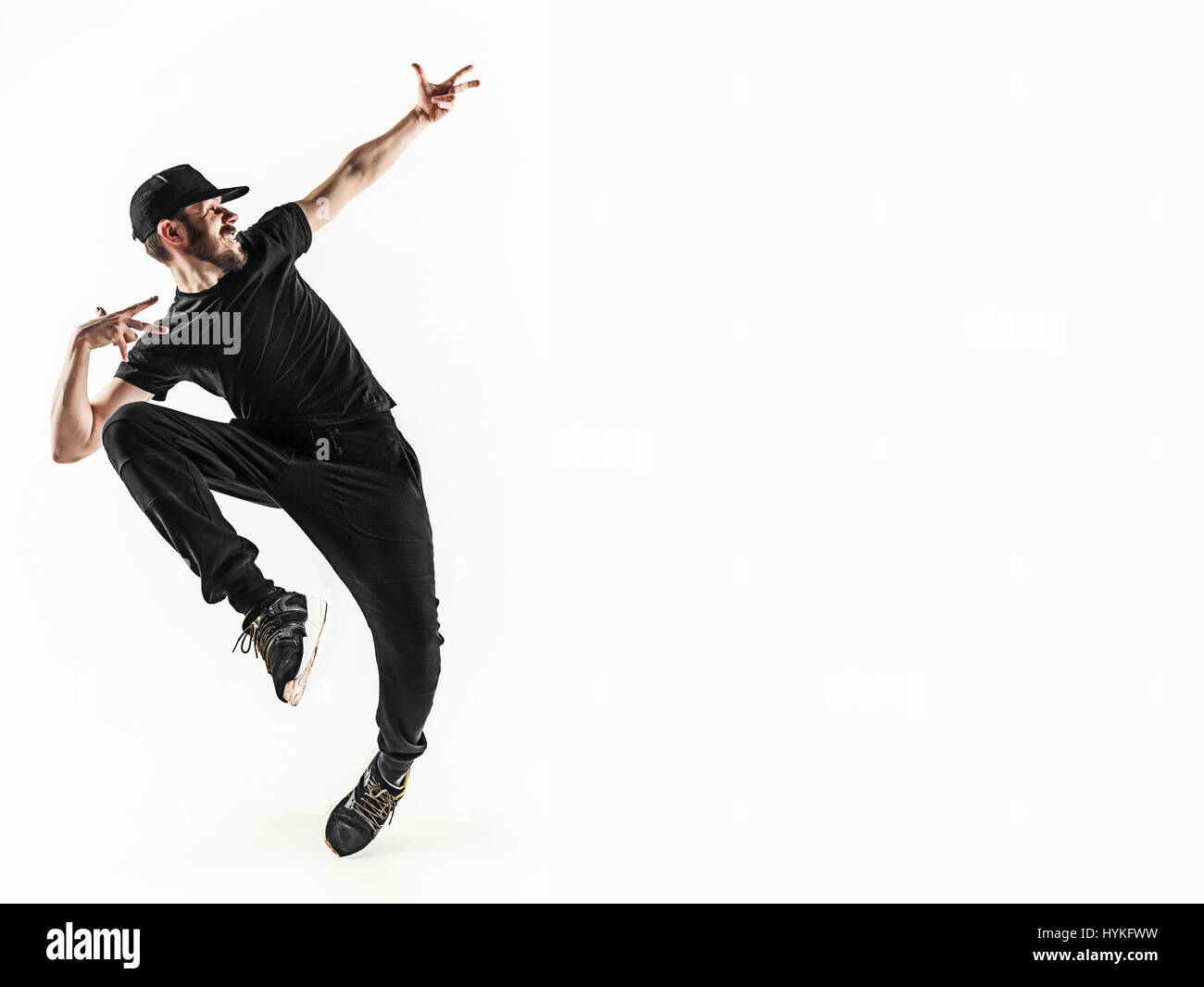The silhouette of one hip hop male break dancer dancing on white ...