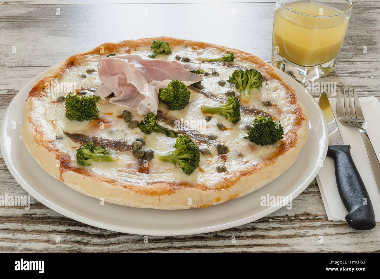 whole pizza with ham Stock Photo - Alamy