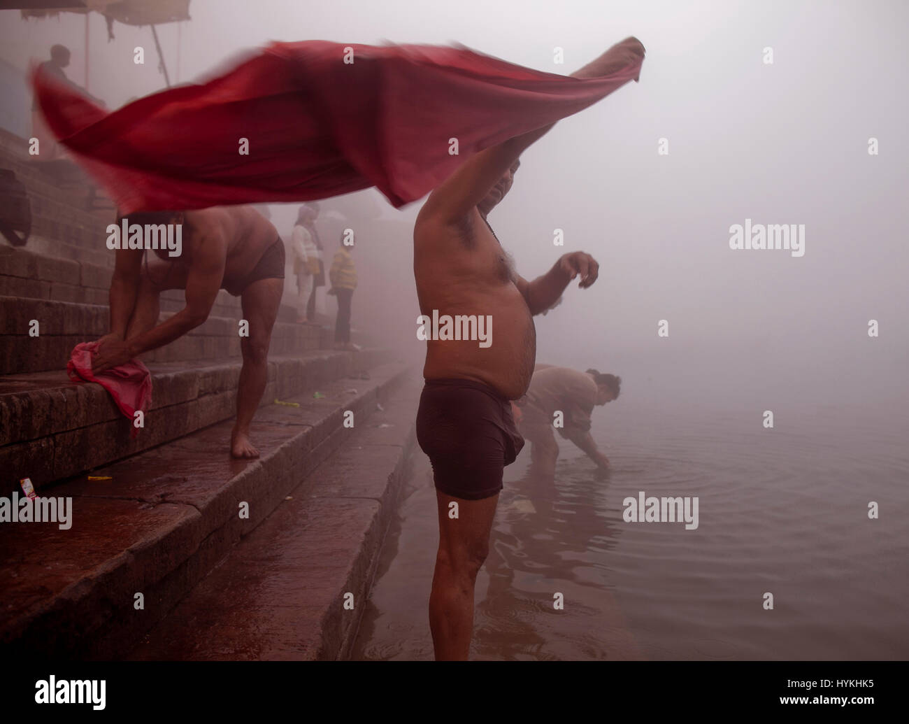 A man taking a bath in the holy river "Ganges" in Vanarasi, India. The ...