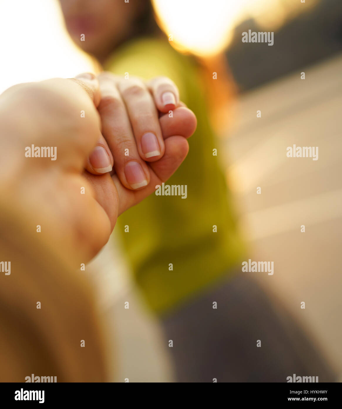 Follow me - happy young woman pulling guy's hand - hand in hand walking ...