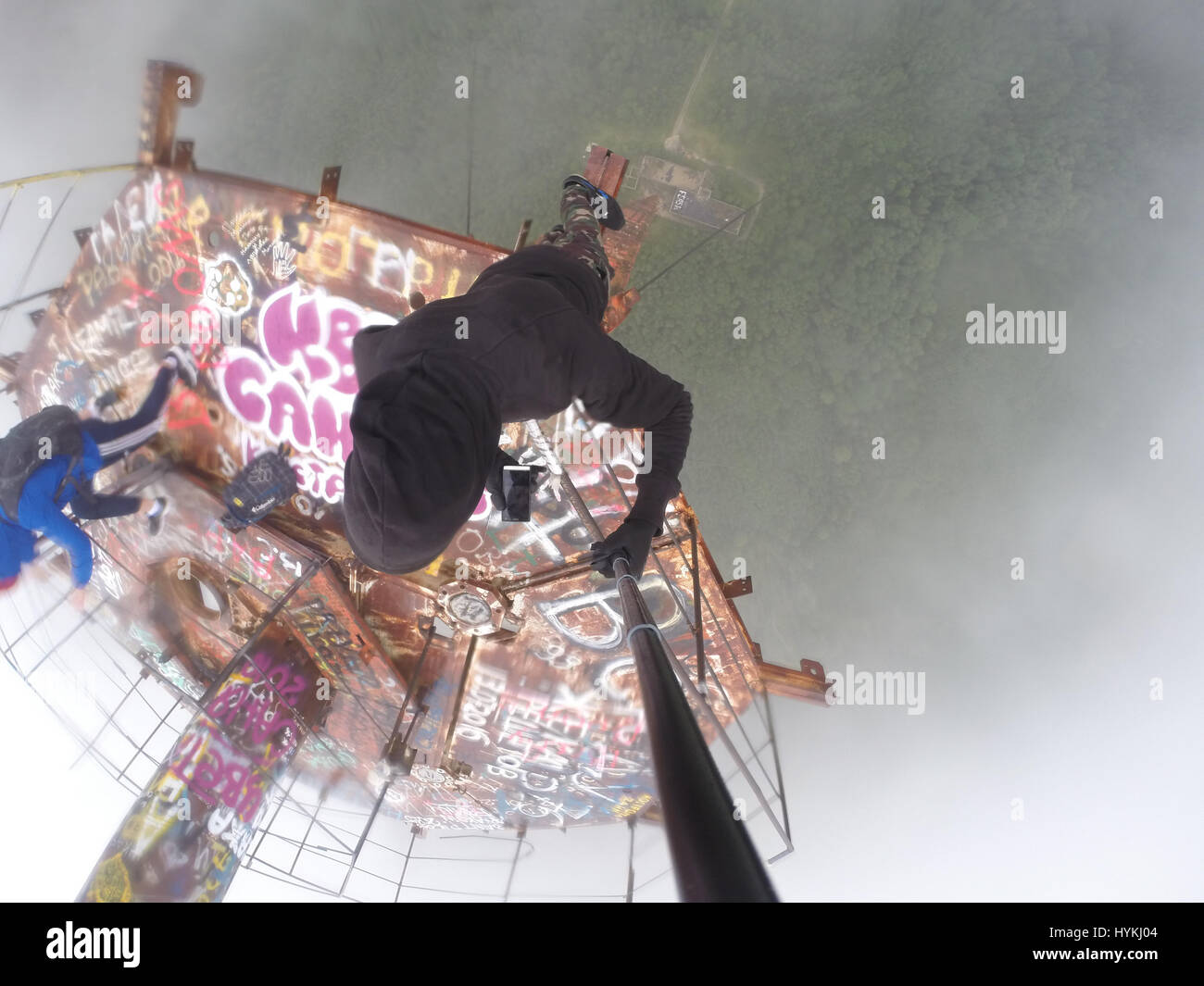 Urban explorer, Alex Nomernoy climbing a TV tower. A DAREDEVIL teenager ...