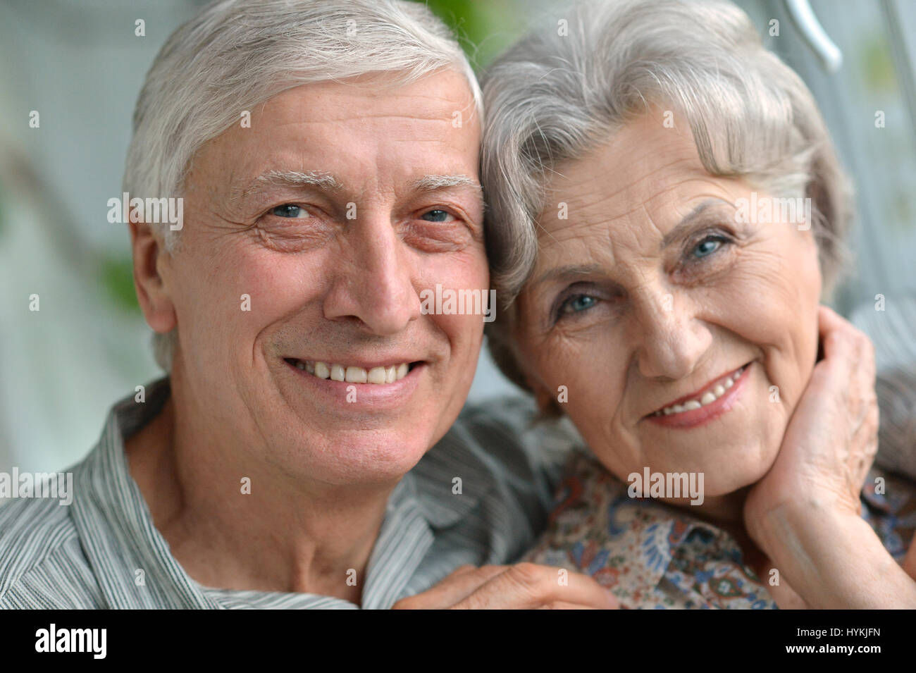 Happy elderly couple embracing Stock Photo - Alamy