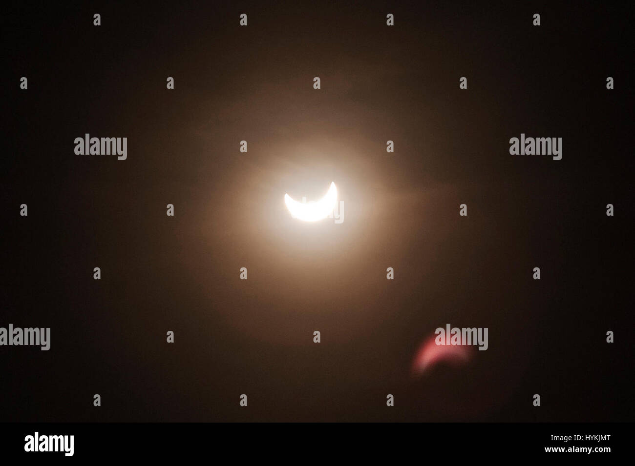 JAKARTA, INDONESIA - MARCH 08 : A partial solar eclipse is seen in ...