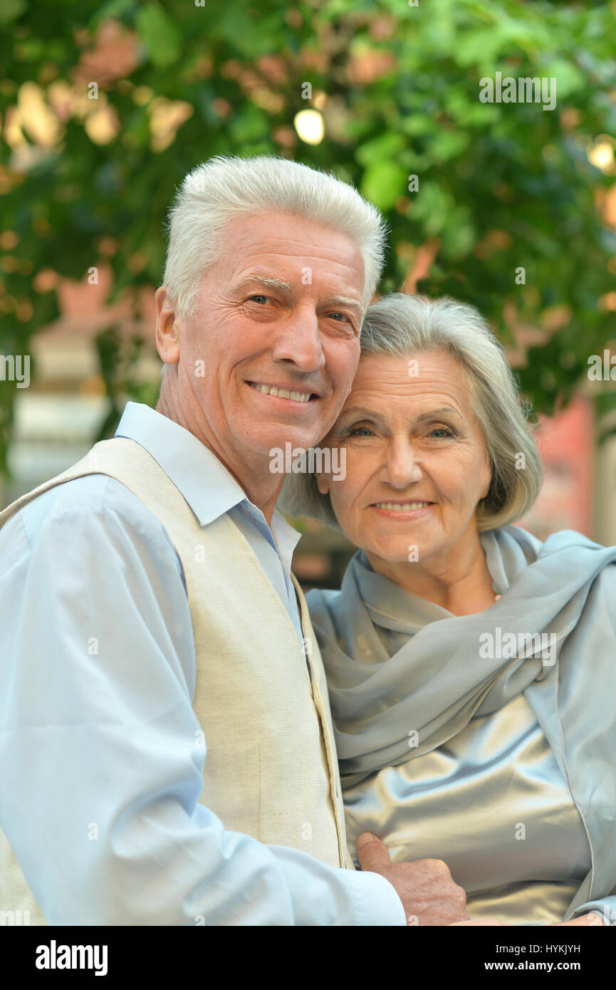 Happy elderly couple embracing Stock Photo - Alamy