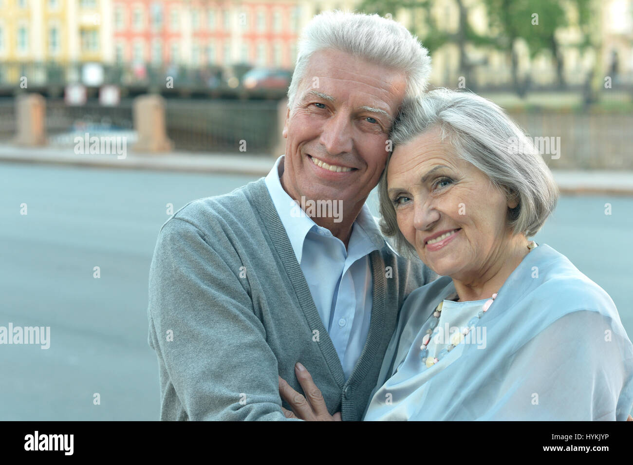 Happy elderly couple embracing Stock Photo - Alamy