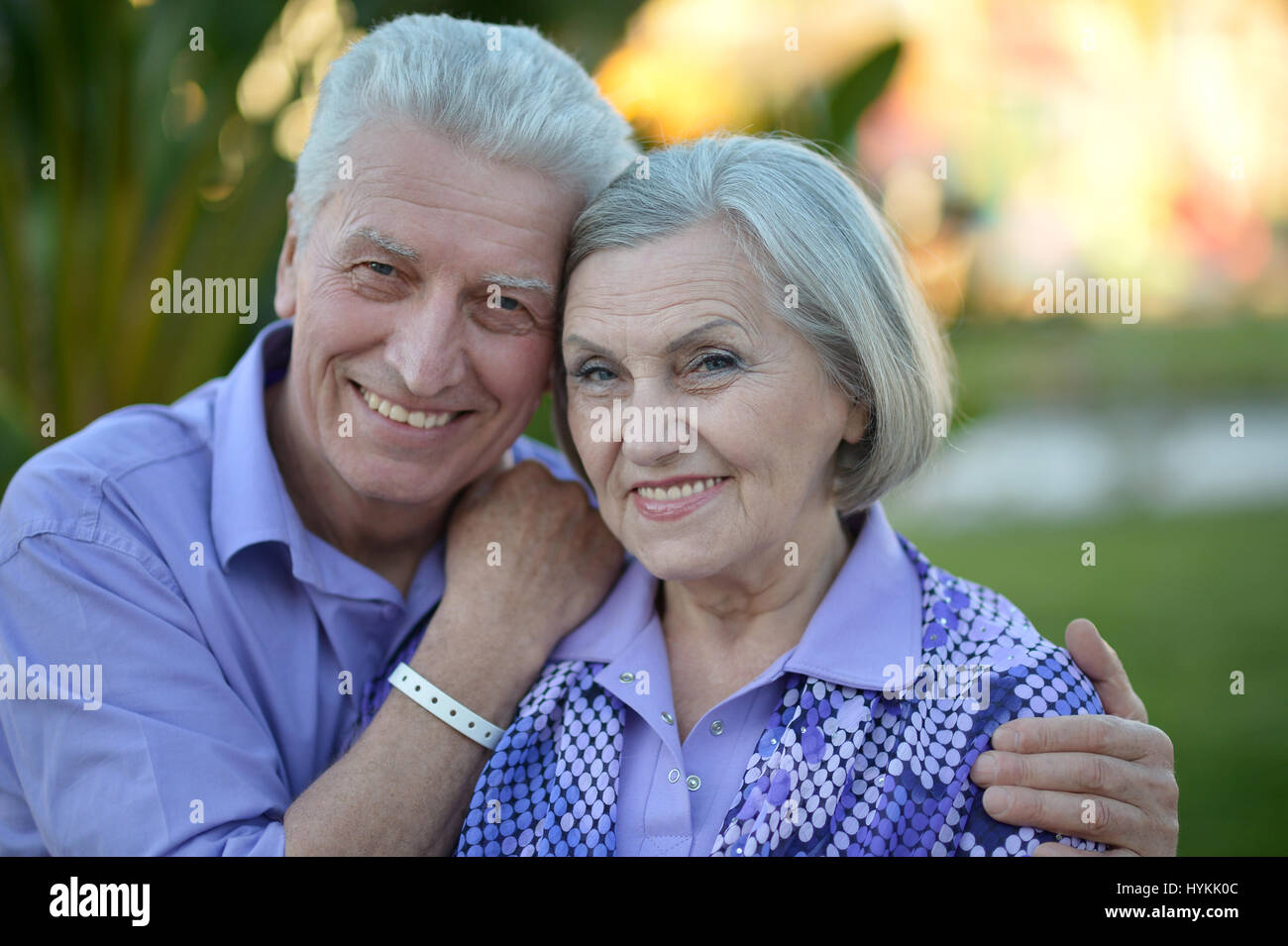 Happy elderly couple embracing Stock Photo - Alamy