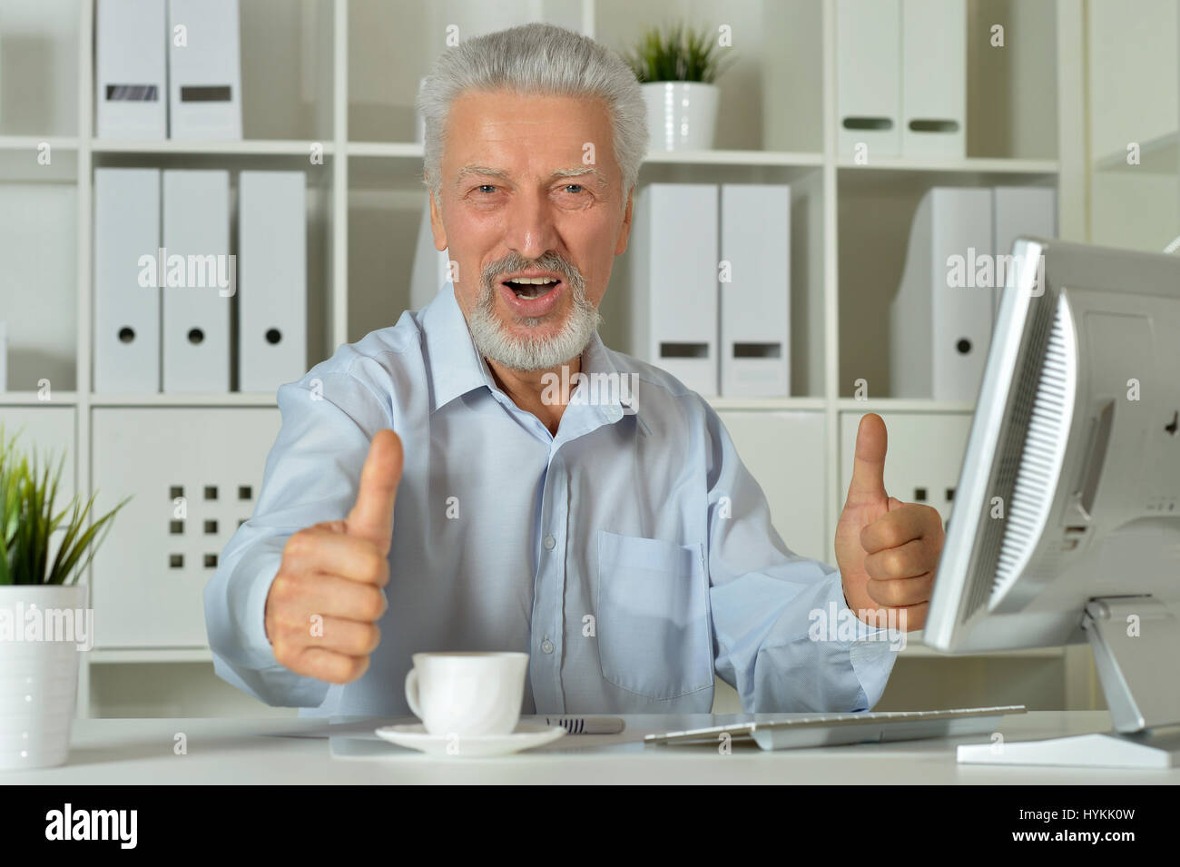 Portrait of a old business woman using laptop Stock Photo - Alamy