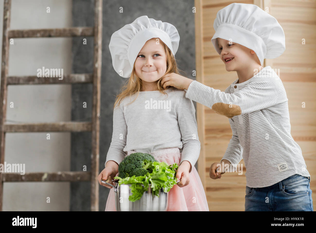 Brother and sister are Chefs. Full pot of vegetables. Healthy food ...