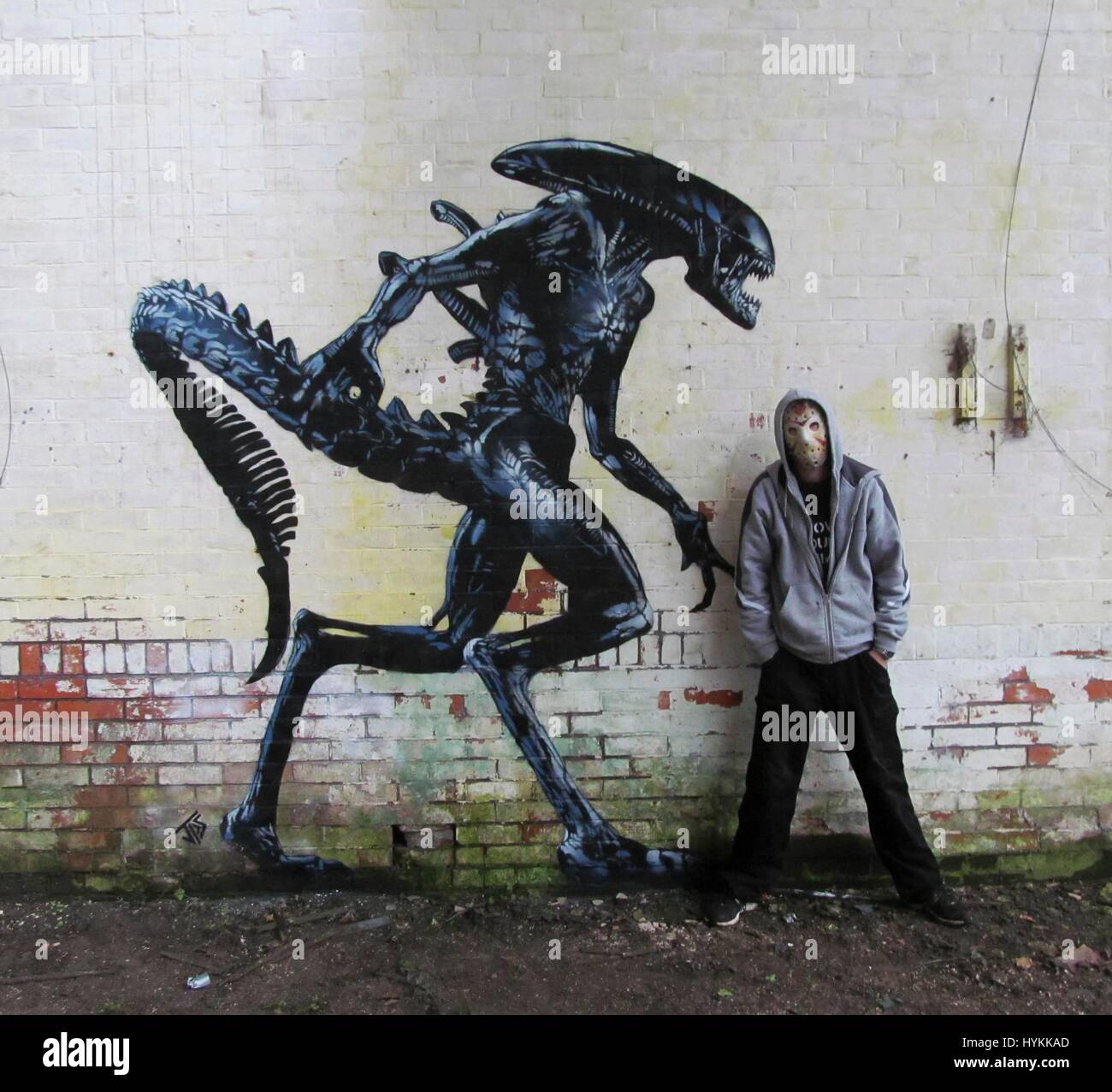 WELLINGTON, UK: Artist JPS stands next to his ten-foot tall Alien ...