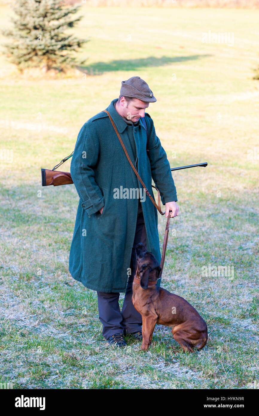hunter with his hunting dog Stock Photo - Alamy