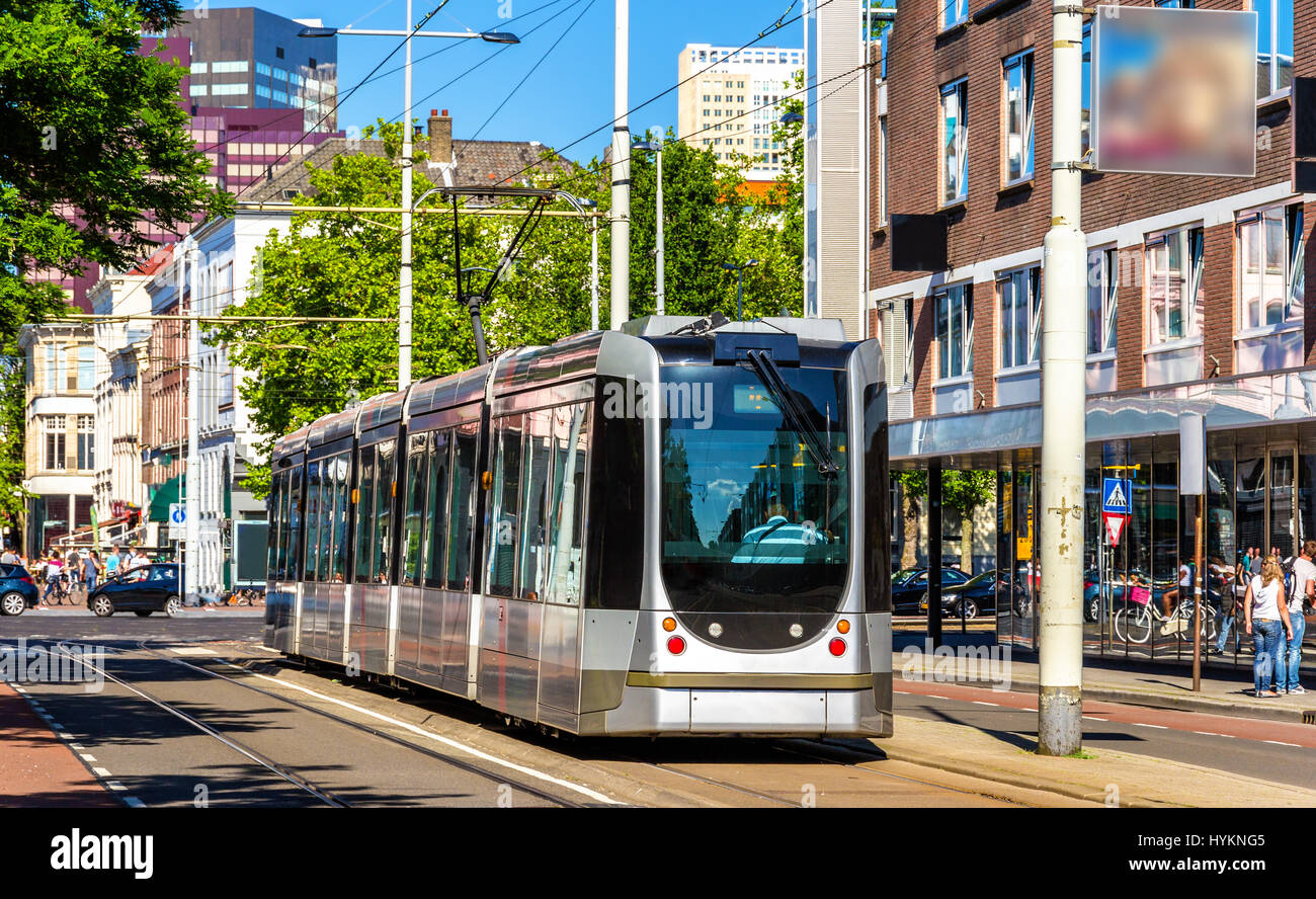Tram on a street of Rotterdam - Netherlands Stock Photo - Alamy