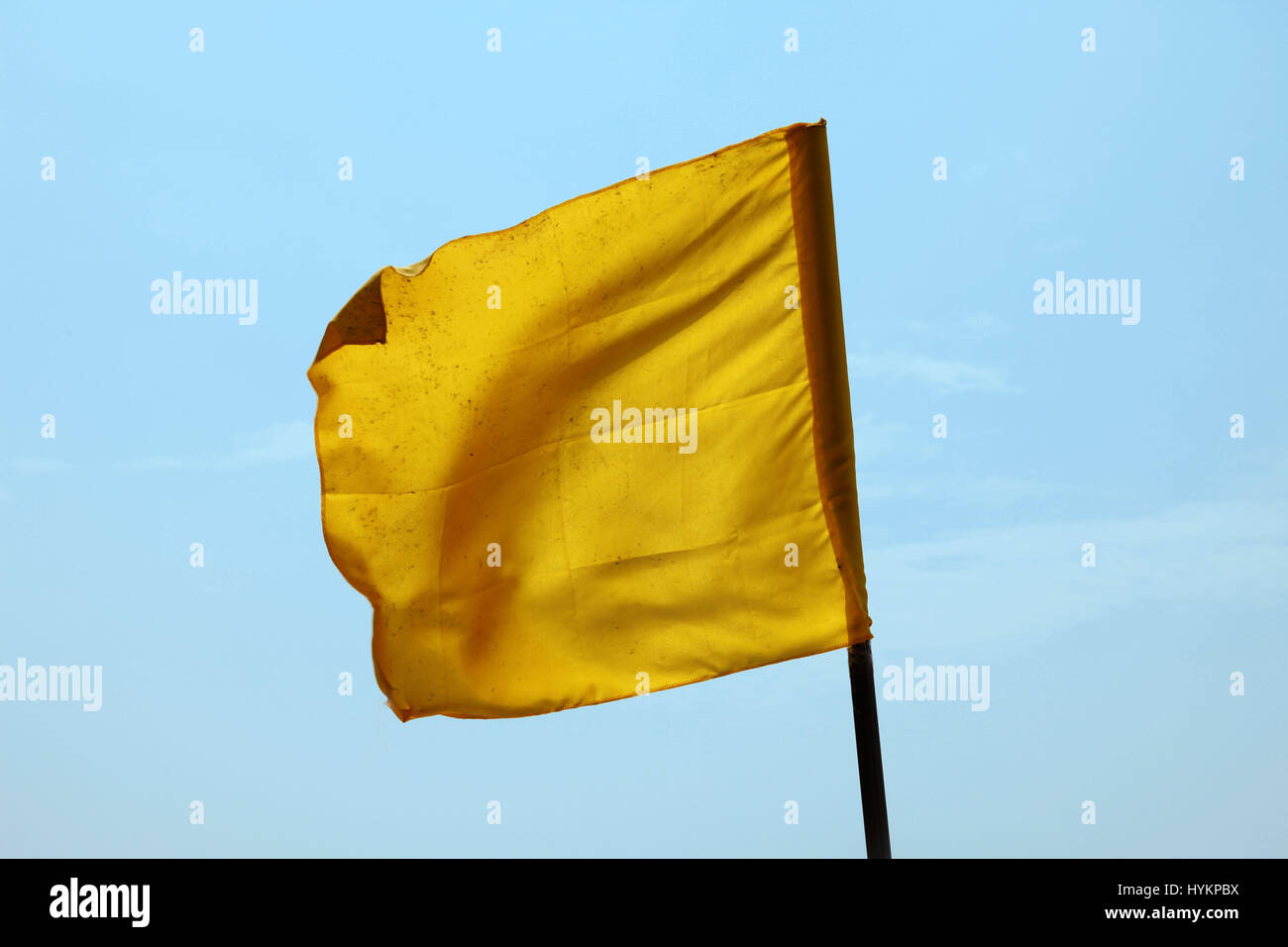 Yelow flag on the beach Stock Photo - Alamy