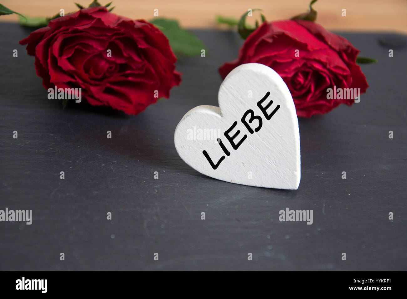 nice background with roses and a white heart Stock Photo - Alamy