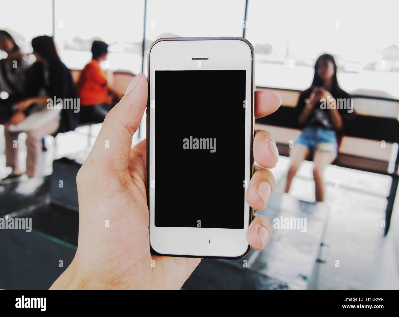 hand hold a phone blurred background Stock Photo - Alamy