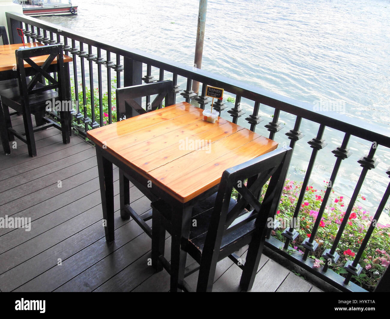 table in restuarant with river background Stock Photo - Alamy
